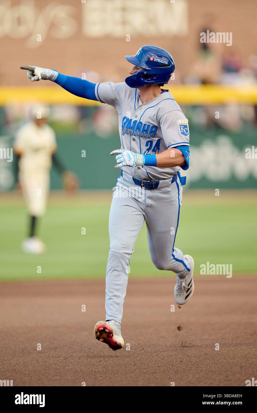 Cam Devanney (24) of the Omaha Storm Chasers rounds the bases after ...