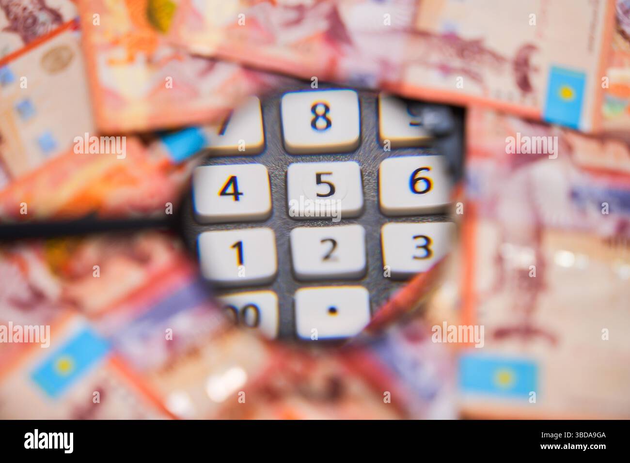 Calculator buttons in magnifying glass. Financial report Stock Photo ...