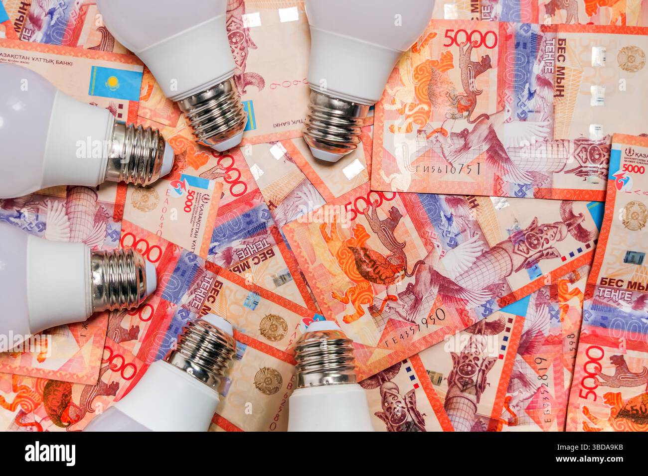 LED lamps with E27 base on tenge banknotes. Payment for electricity ...