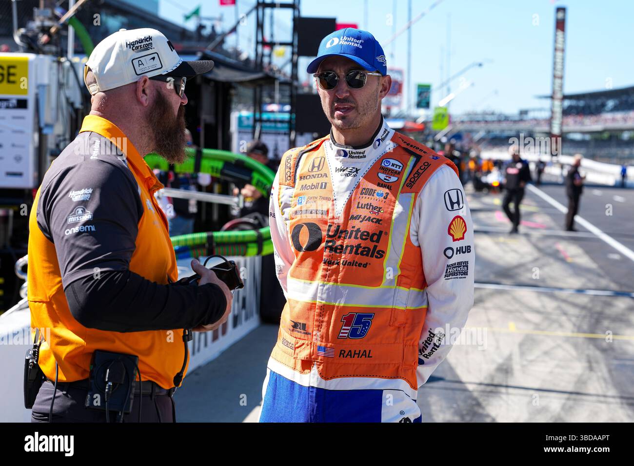 Graham Rahal talks with a member of his crew before the start practice ...