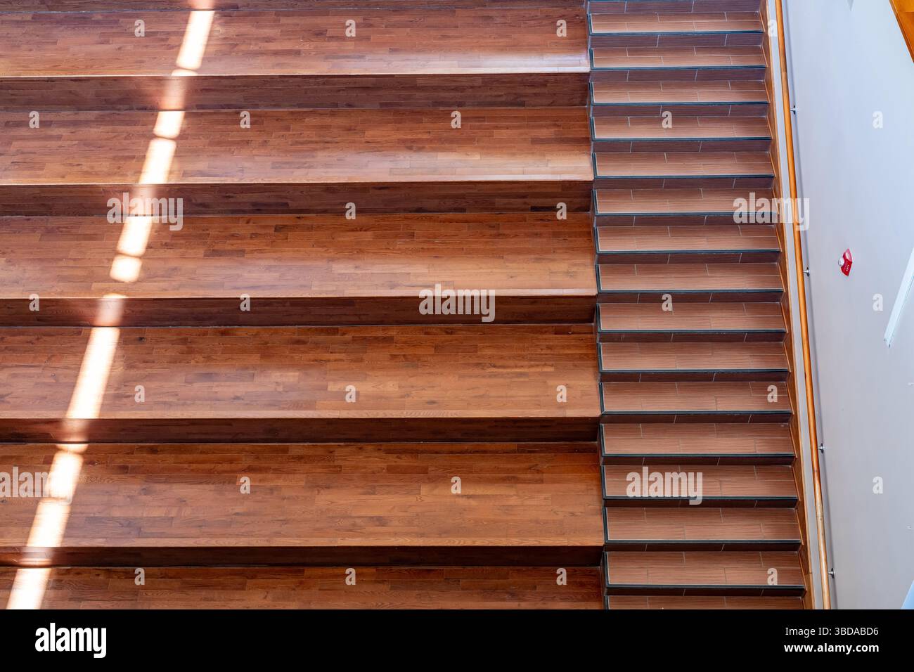 Wooden stadium, stepped seating area with staircase integrated into the ...