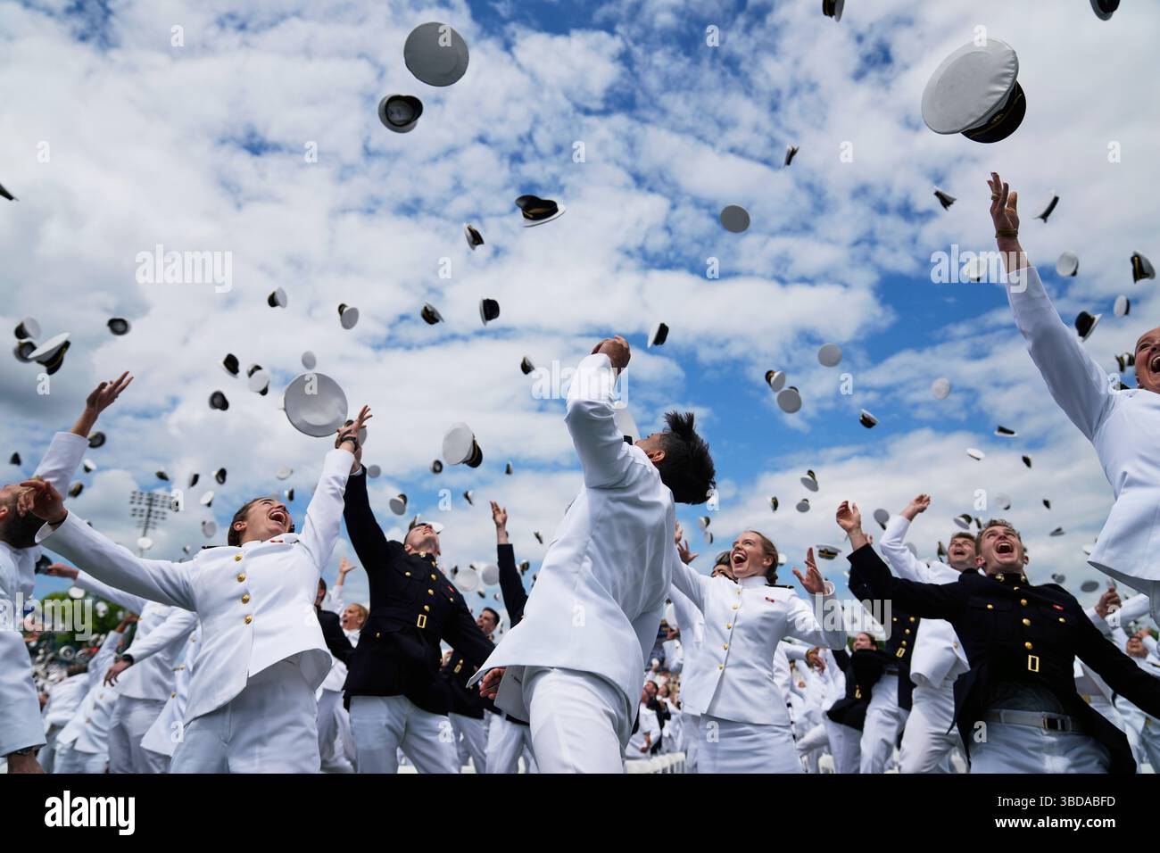 Graduates of the U.S. Naval Academy toss their caps during the academy ...