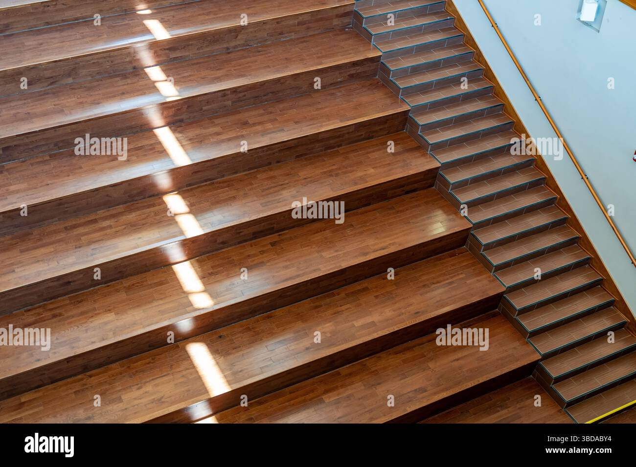 Wooden stadium, stepped seating area with staircase integrated into the ...