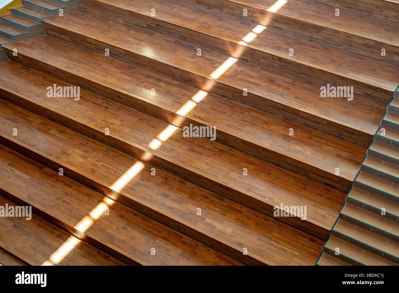 Wooden stadium, stepped seating area with staircase integrated into the ...