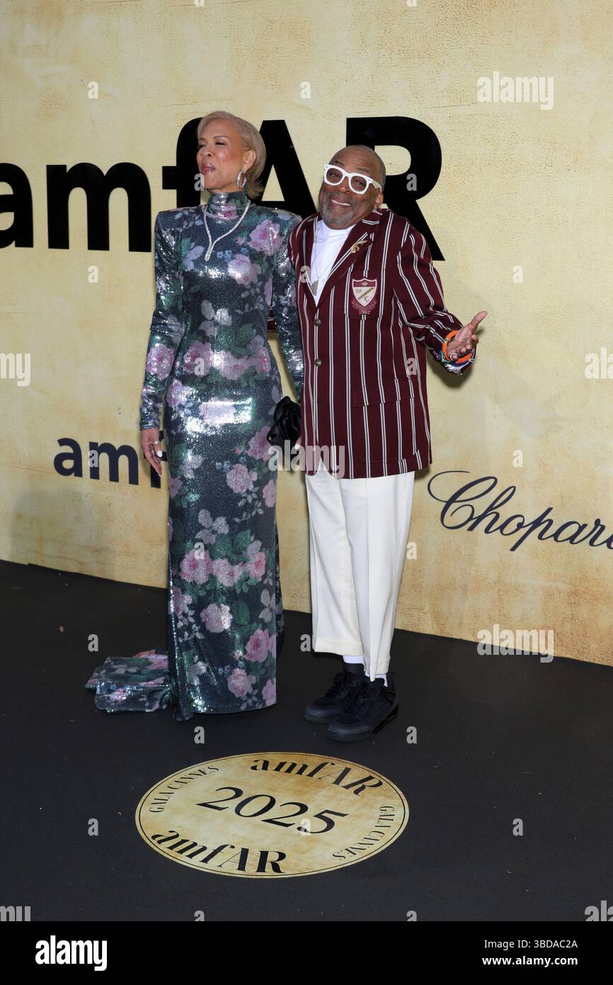 Spike Lee, Tonya Lewis Lee attend the amfAR Gala Cannes 2025 presented ...