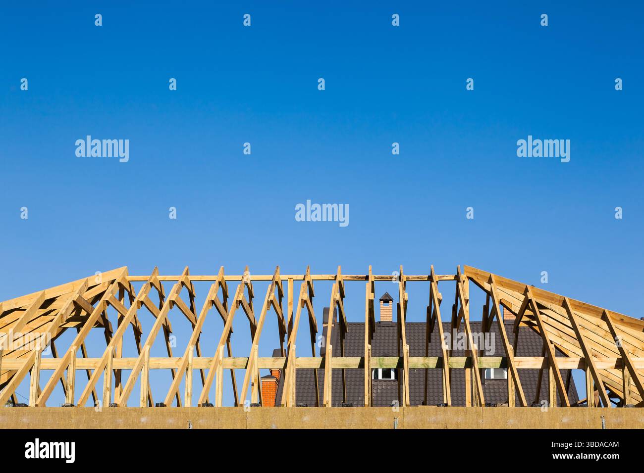Construction of the roof of a new private house. New wooden beams ...