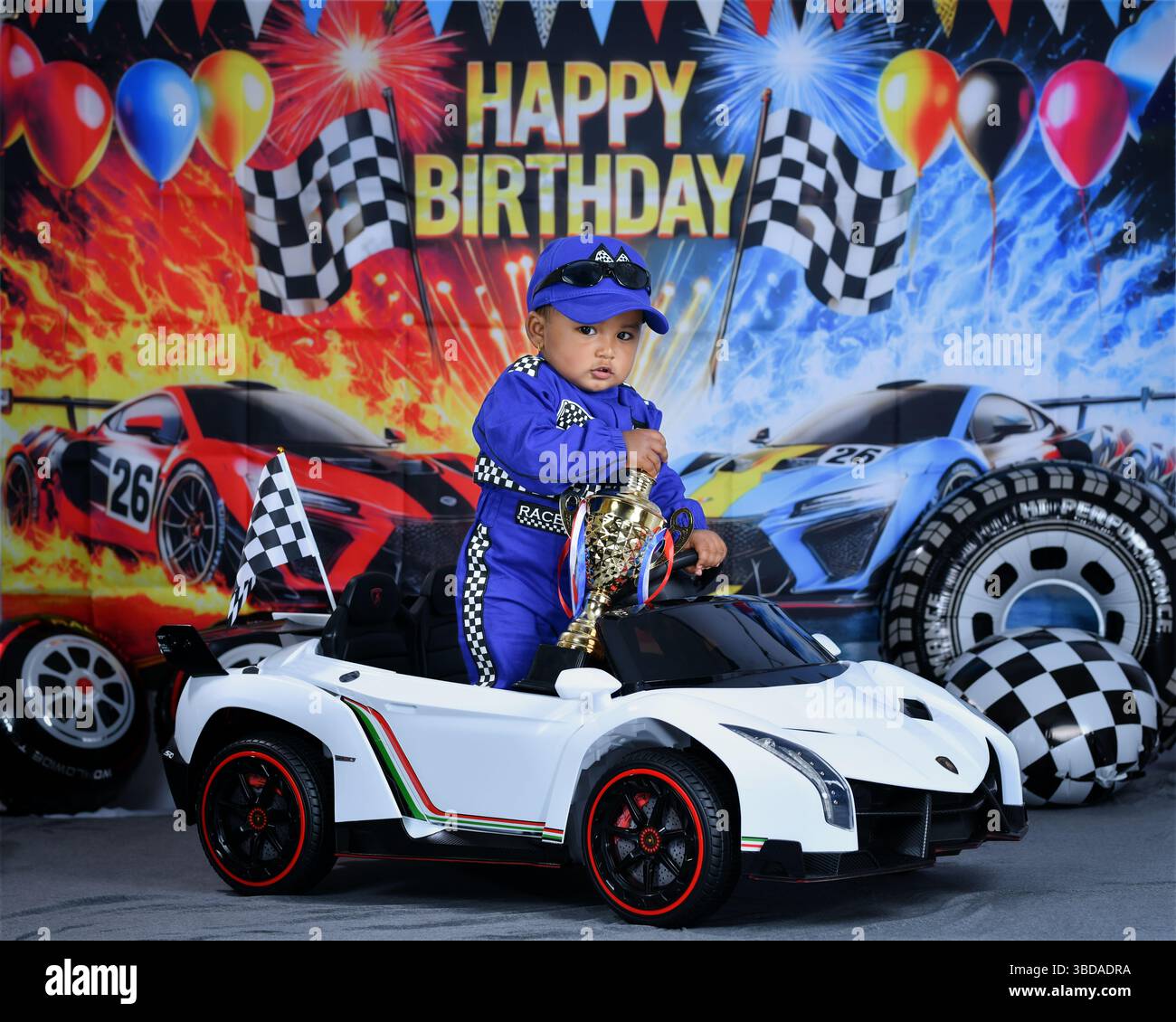 Baby boy celebrates his first birthday dressed as a race car driver ...