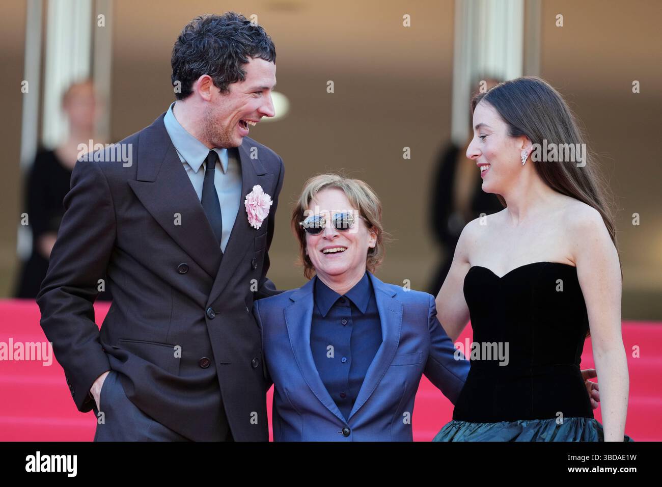 Josh O'Connor, left, director Kelly Reichardt and Alana Haim pose for ...