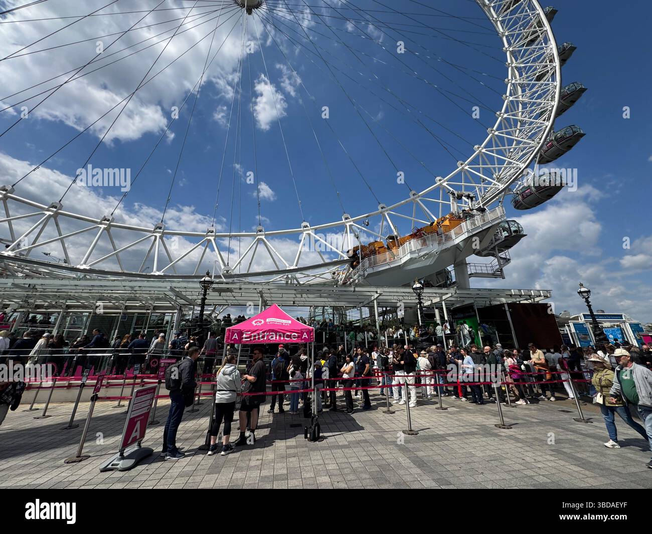 Very busy queue for the London Eye on the South Bank in London, UK ...
