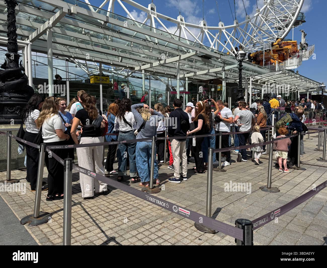 Very busy queue for the London Eye on the South Bank in London, UK ...