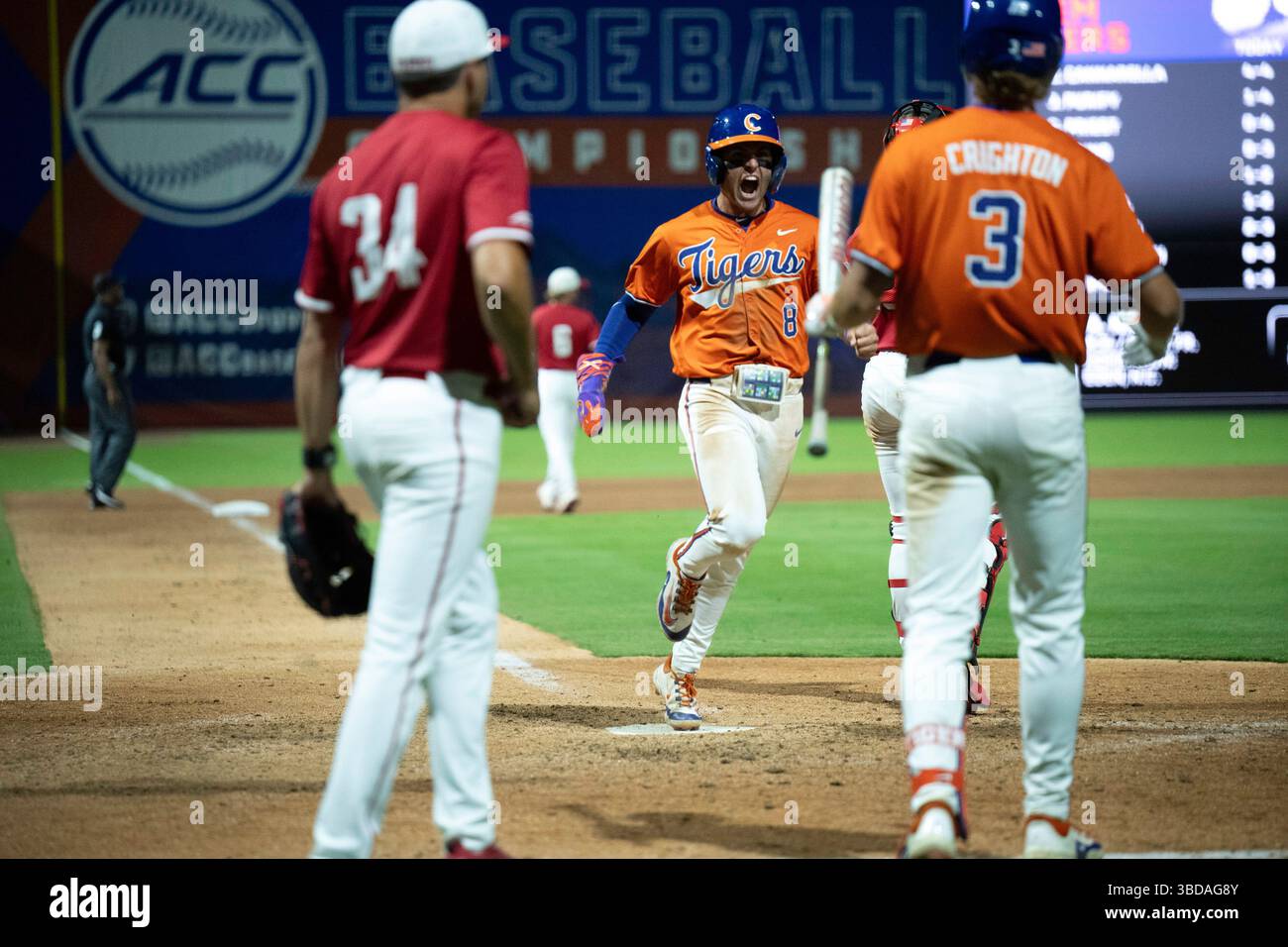 Josh Paino (8) of the Clemson Tigers scores the tying run during an ACC ...