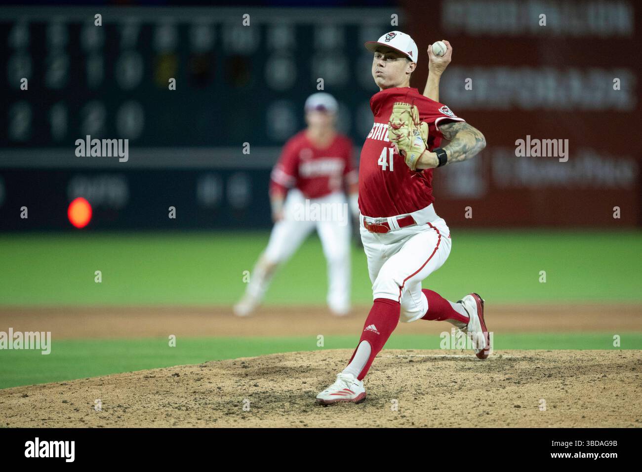 Jacob Dudan (41) of the NC State Wolfpack delivers a pitch during an ACC Baseball Tournament ...