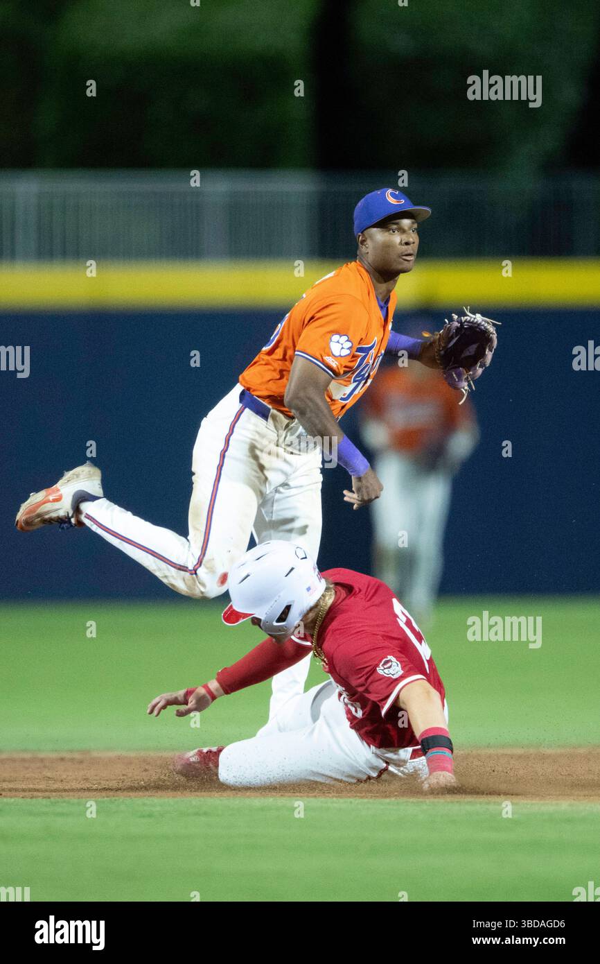 Clemson Tigers second baseman Jarren Purify (23) throws to first base ...