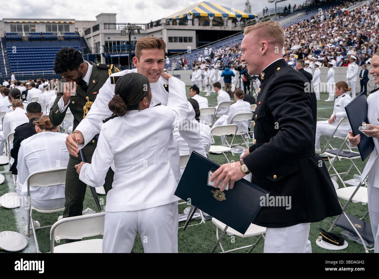 Annapolis, United States. 23rd May, 2025. Midshipmen share hugs after ...