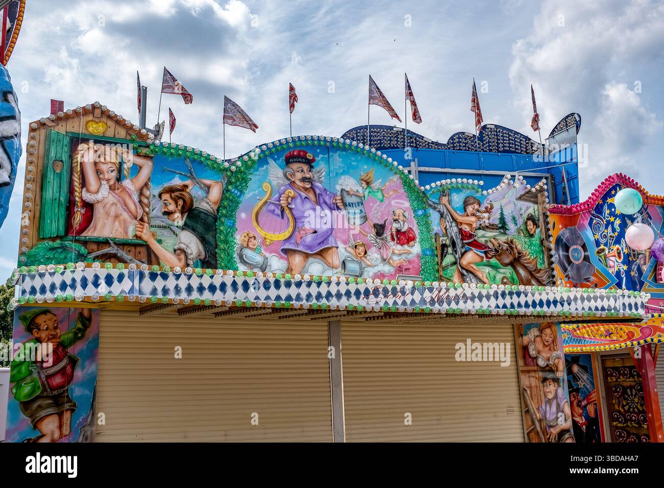 The image captures a lively amusement park ride adorned with vibrant ...