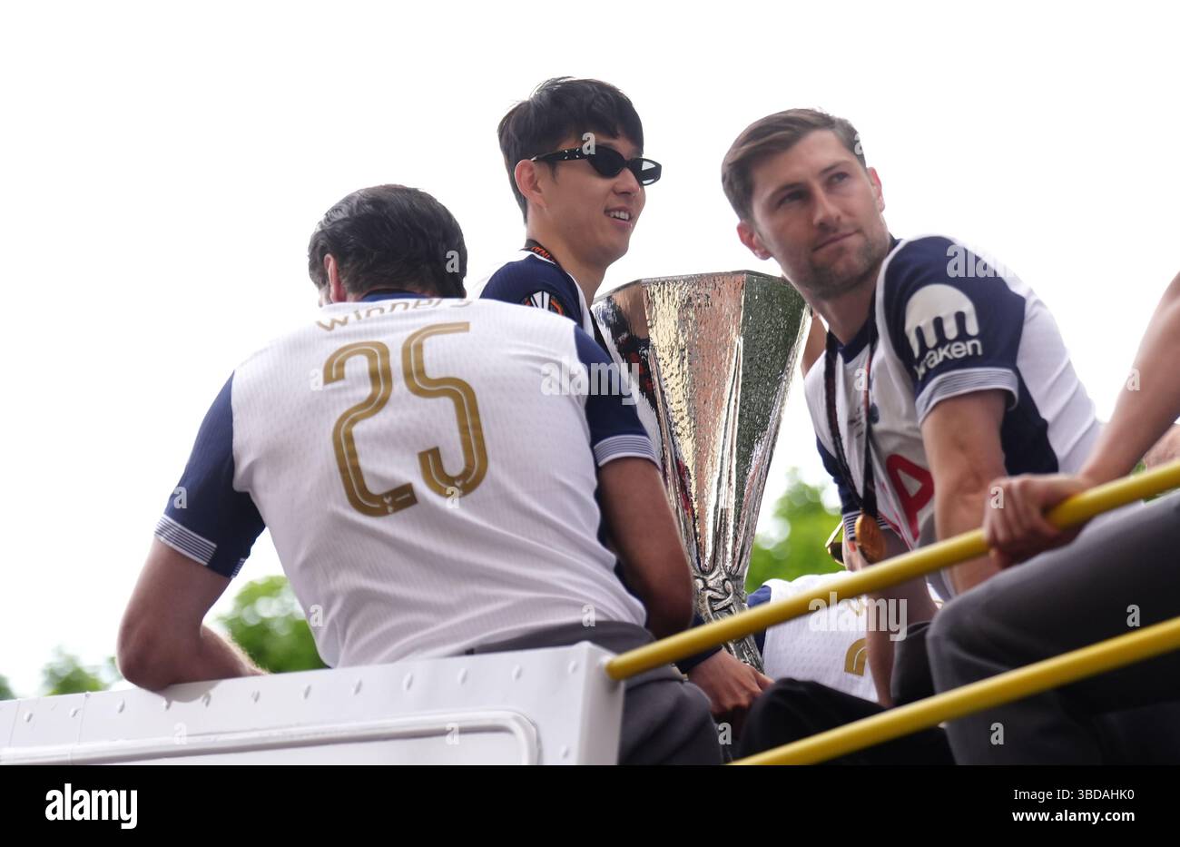 Tottenham Hotspur's Son Heung-Min with the trophy on the open-top team ...