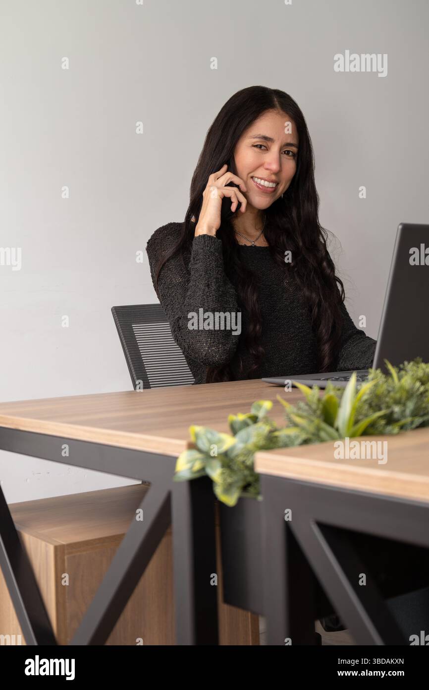 Focused professional woman multitasking workplace hi-res stock ...