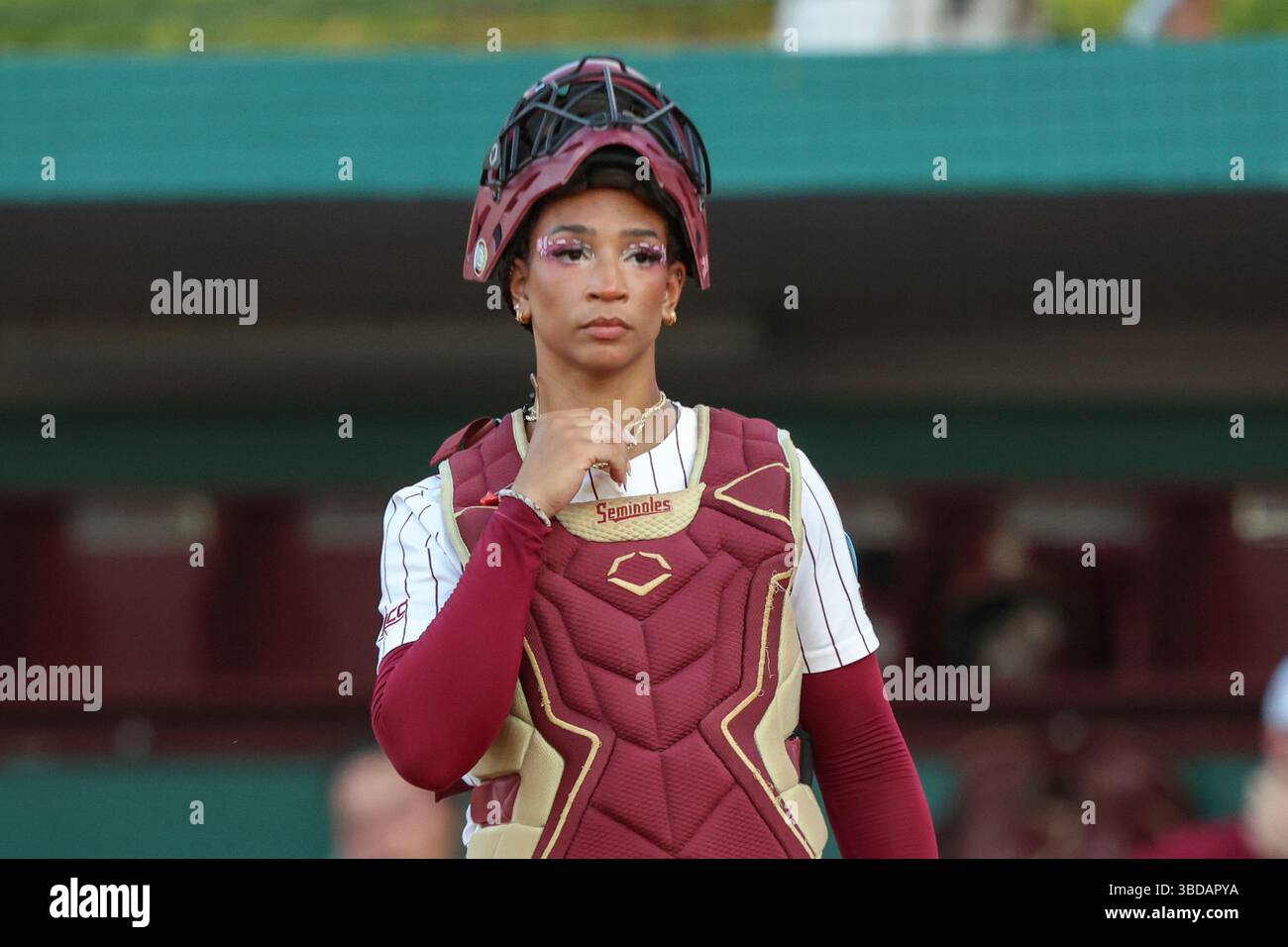 Florida State catcher Michaela Edenfield (51) looks to a teammate ...