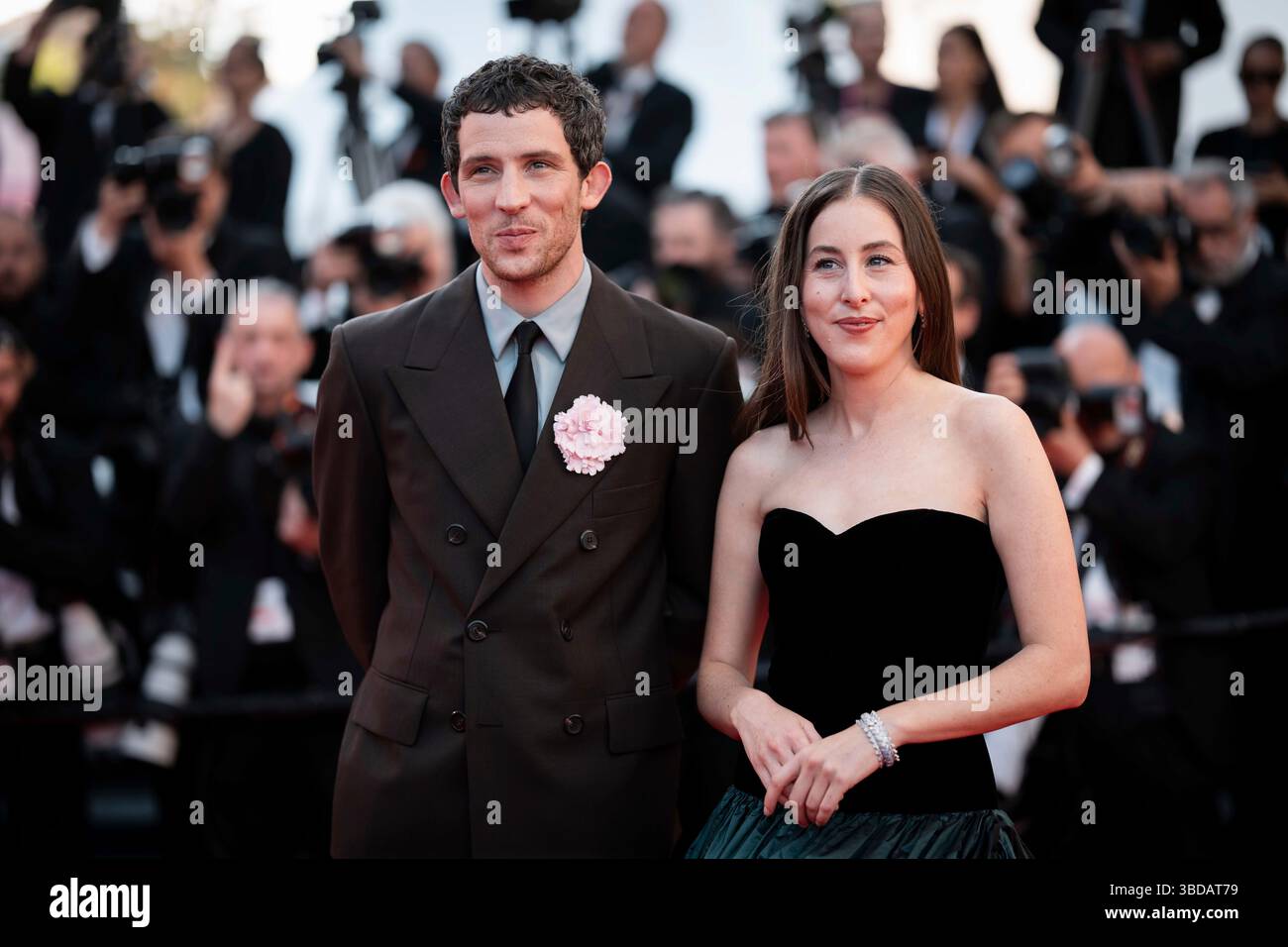 Josh O'Connor, left and Alana Haim pose for photographers upon arrival ...