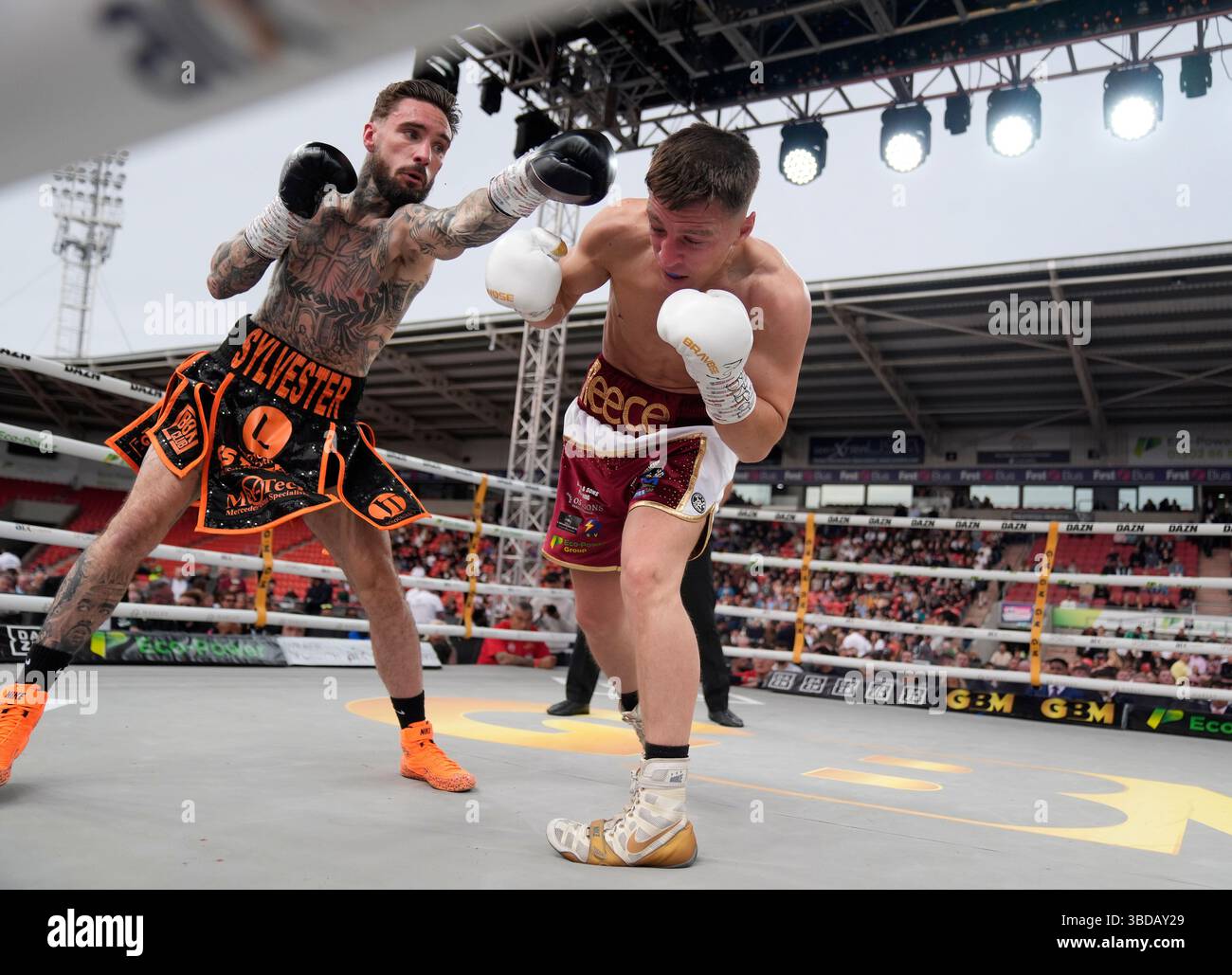 Lewis Sylvester (left) lands a punch on Reece Mould during their IBO ...