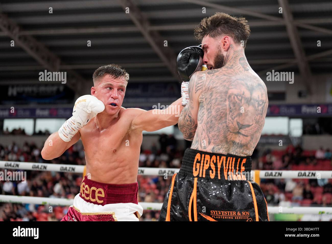 Reece Mould (left) lands a punch on Lewis Sylvester during their IBO ...