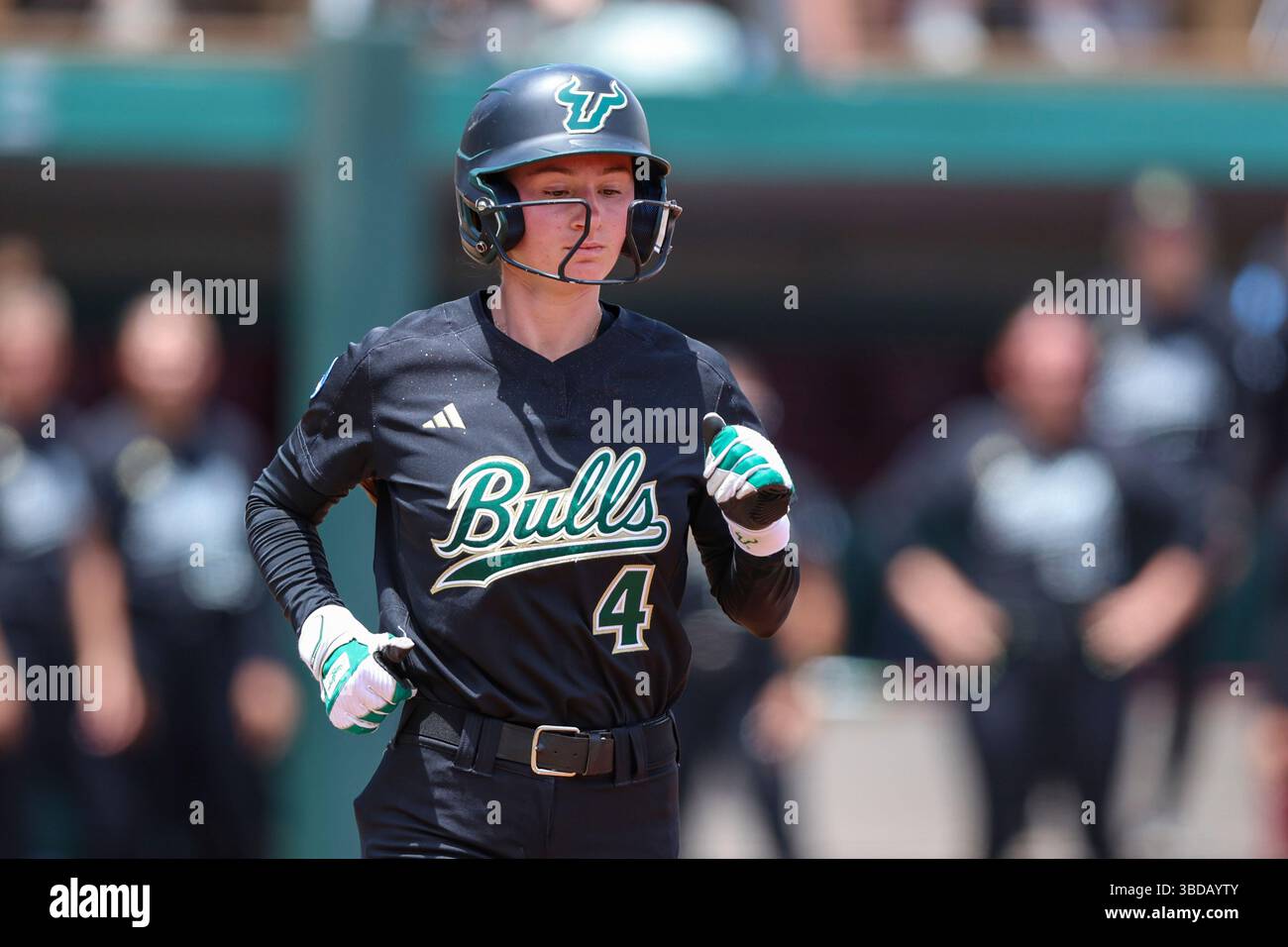 South Florida utility Alexa Galligani (4) runs to first base during an ...