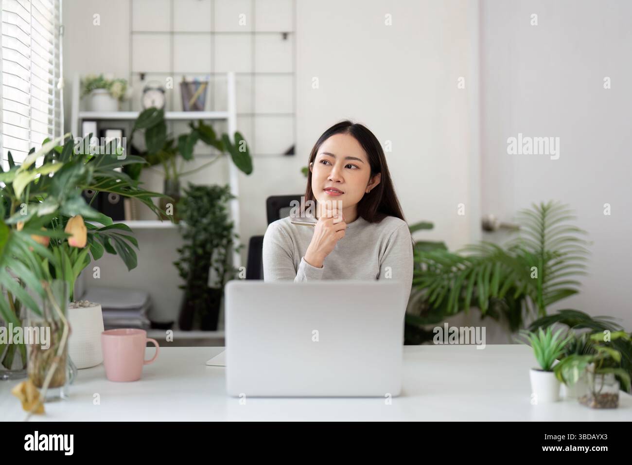 Contemplative Work Environment. Woman thinking deeply in modern home ...