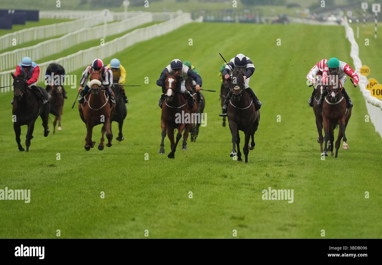Bonus Time (third right) ridden by Gary Carroll on the way to winning ...