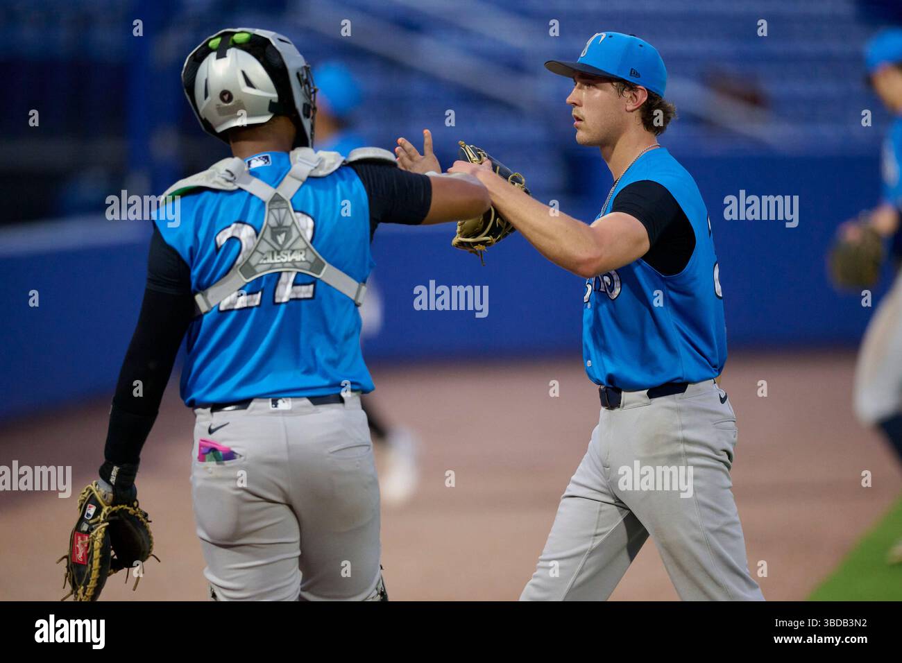 Tampa Tarpons pitcher Griffin Herring (35) fist bumps catcher Engelth ...