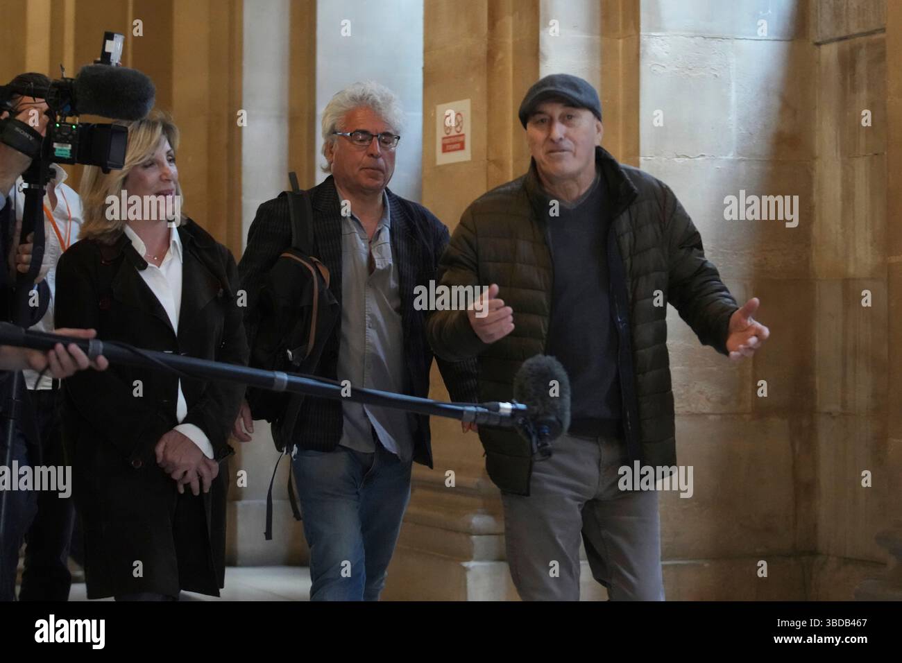 Yunice Abbas, right, one of the men accused in the 2016 armed robbery ...