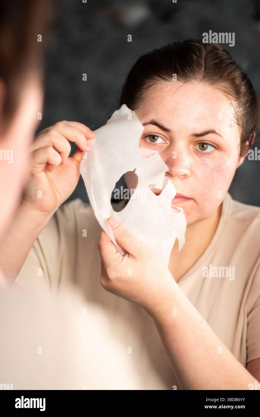 Woman removing sheet face hi-res stock photography and images - Alamy