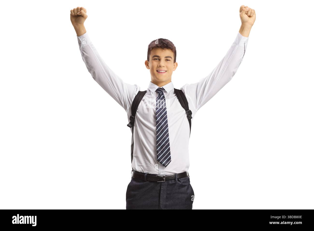 Happy male student wearing a school uniform and raising arms up ...