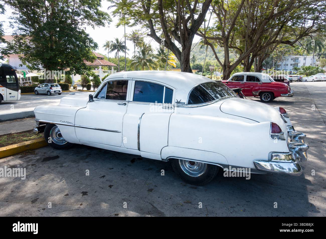 A 1952 Cadillac series 62 sedan in a Cuban hotel parking lot where many ...