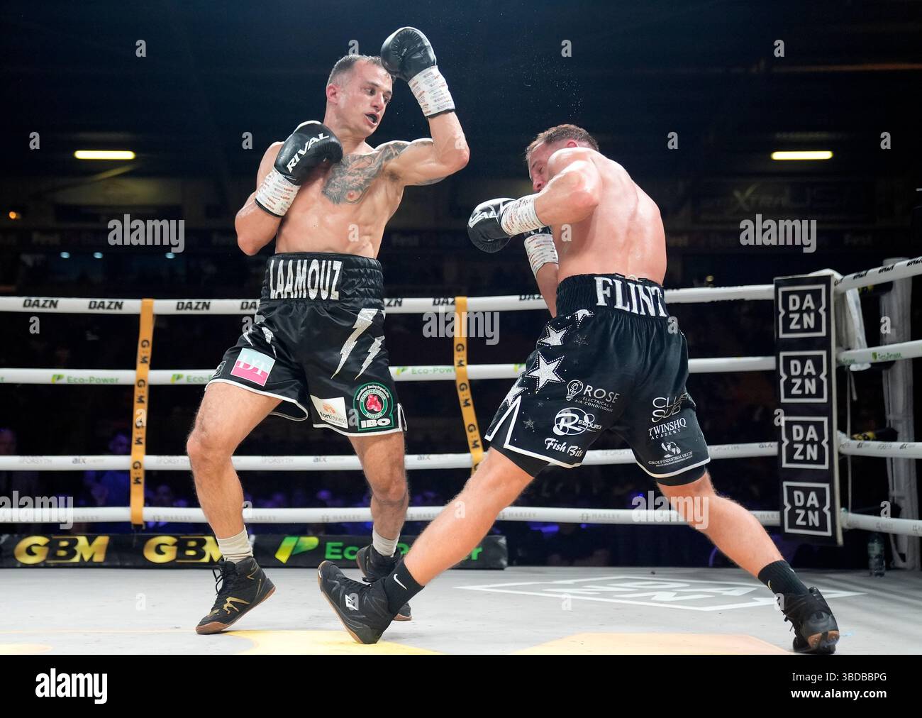 Haithem Laamouz (left) and James Flint in action during their IBO Continental Super Lightweight ...
