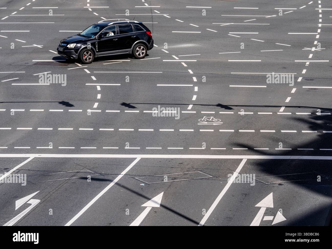Markings at a multi-lane road intersection, lanes for turning vehicles ...