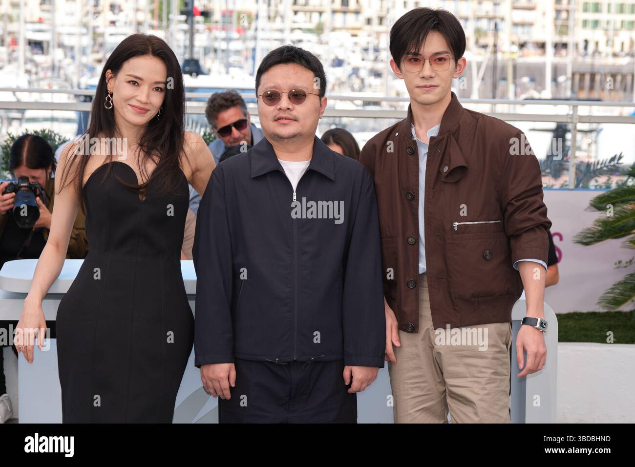 Director Bi Gan and cast members attend the photocall for "KUANG YE SHI DAI" (Resurrection ...
