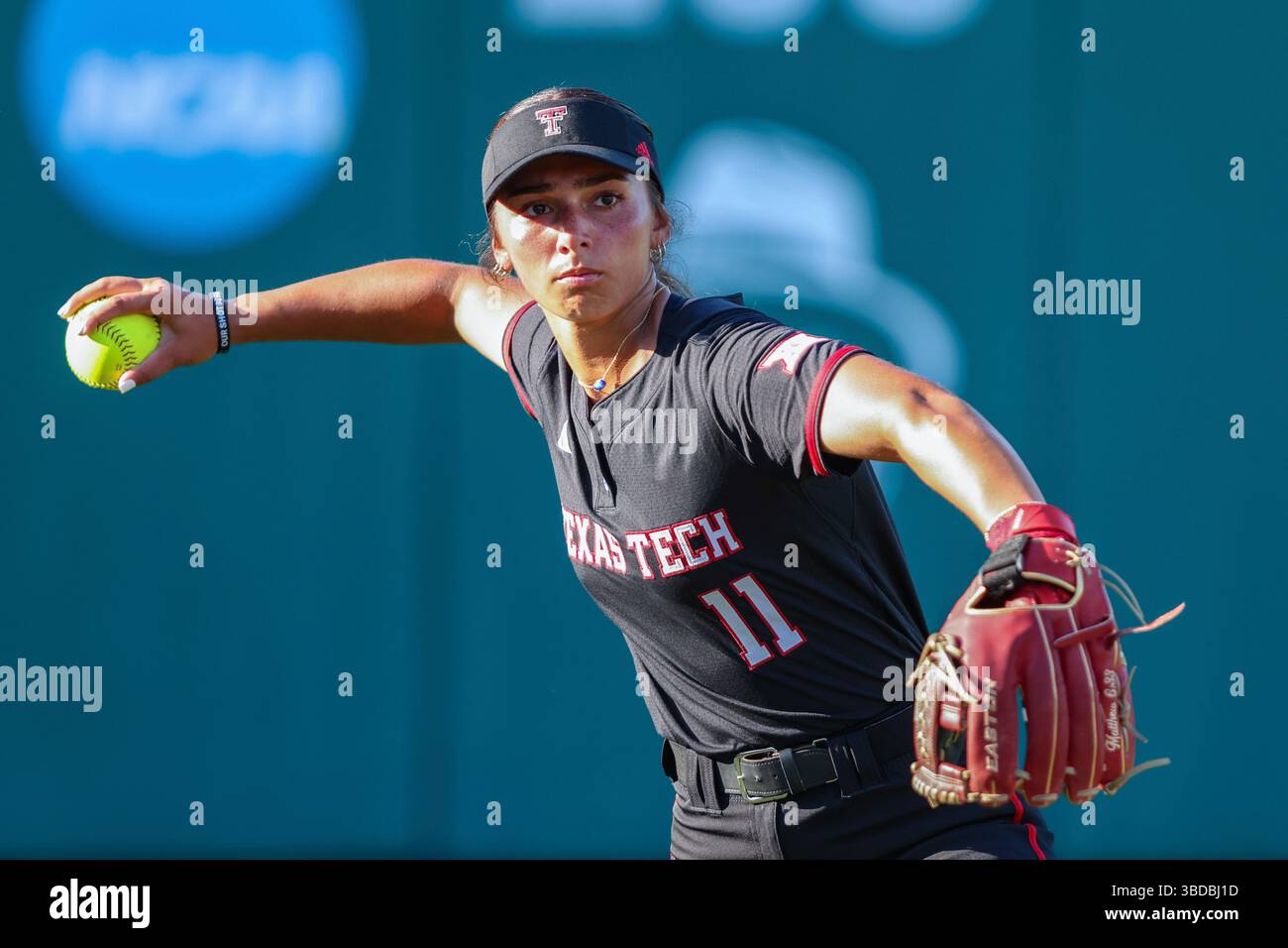 Texas Tech infielder Lauren Allred (11) warms up before an NCAA super ...