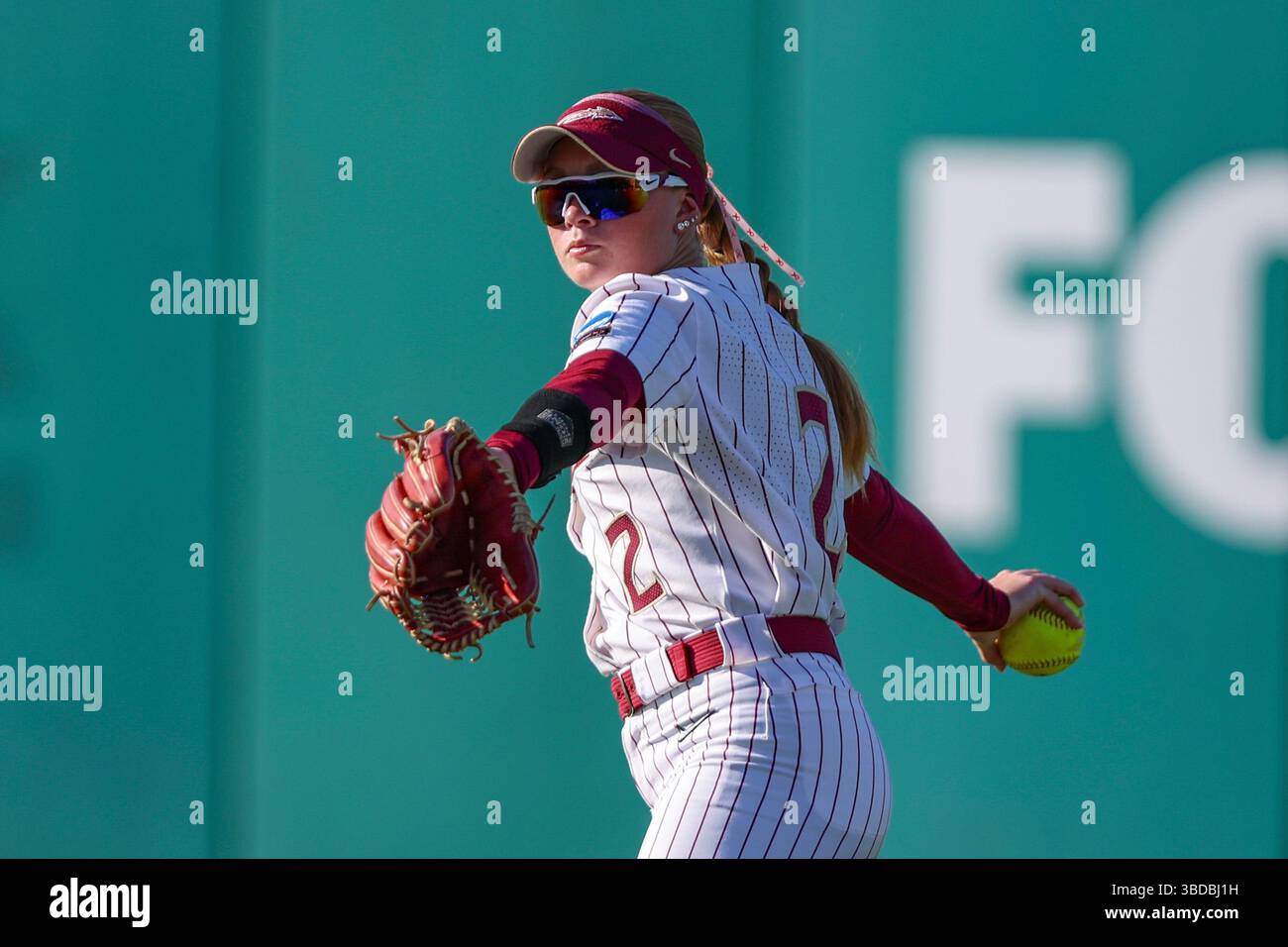 Florida State outfielder Addie DeLong (2) warms up before an NCAA super ...