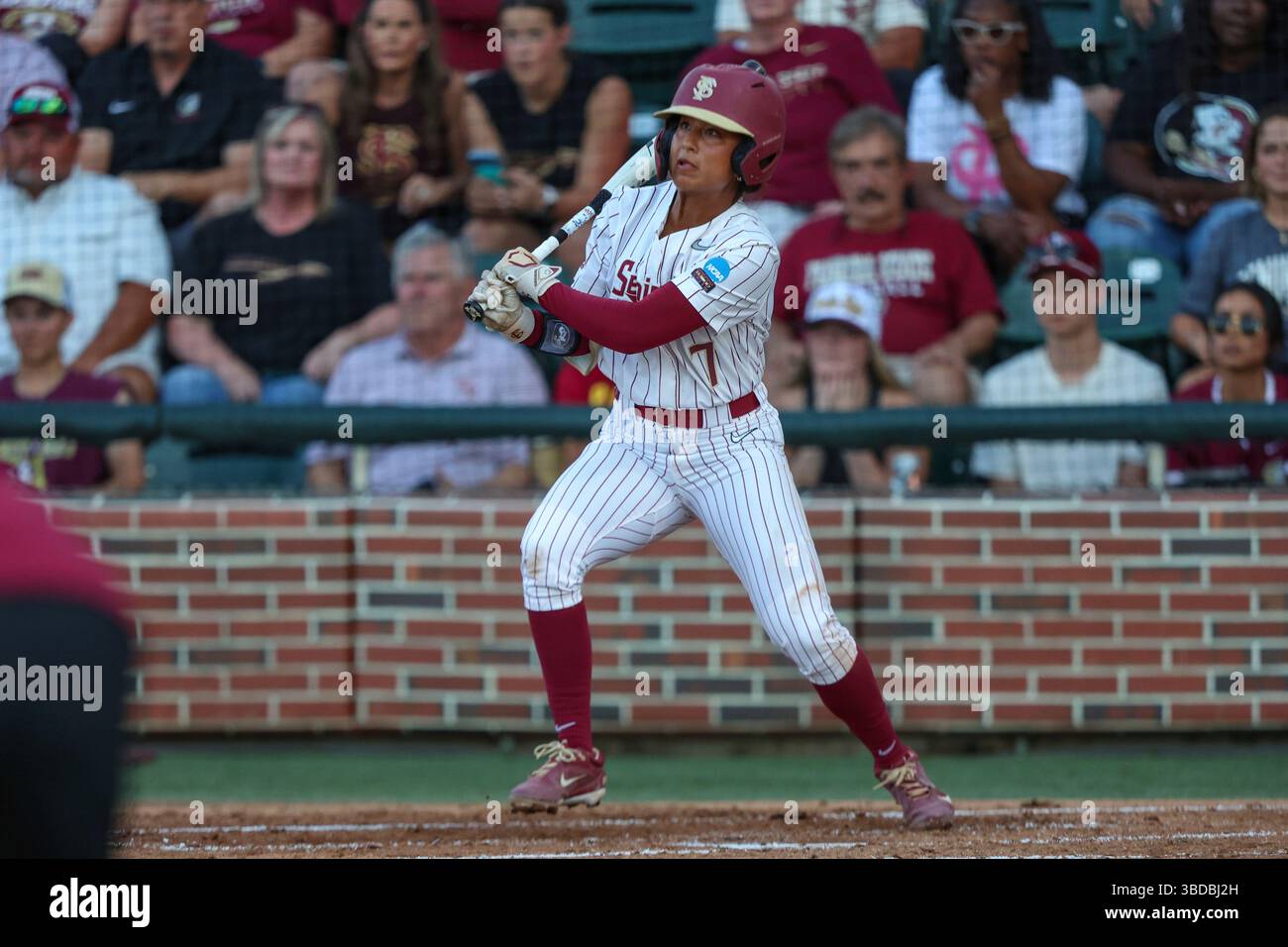 Florida State infielder Angelee Bueno (7) bats during an NCAA super regional softball game ...