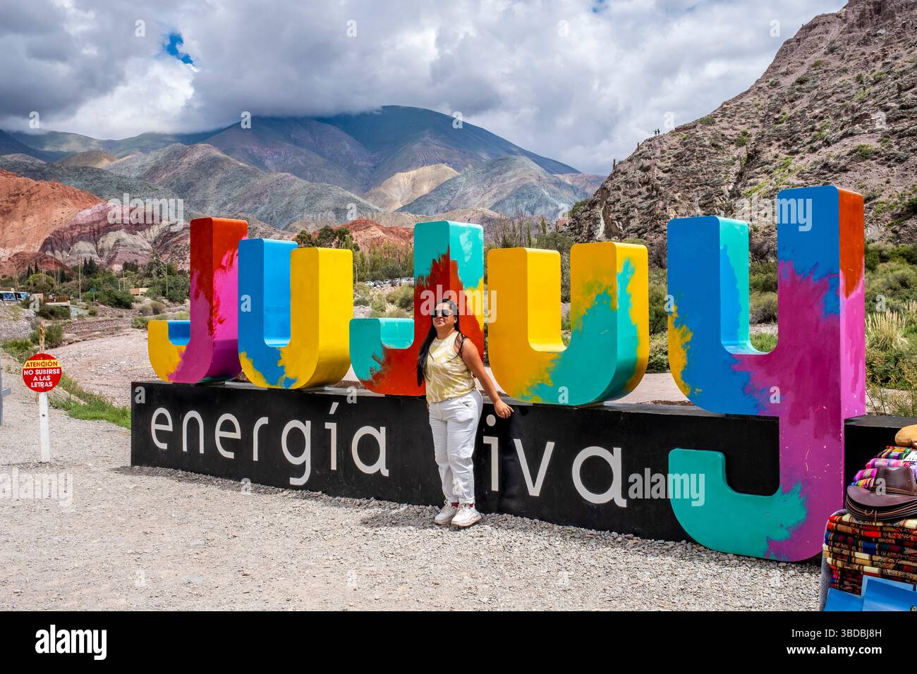 A Young Woman Poses For A Photo At A Colourful 'Jujuy Province' Sign ...