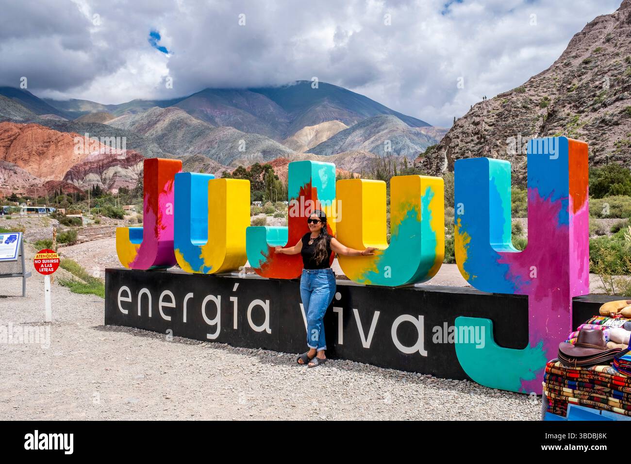 A Young Woman Poses For A Photo At A Colourful 'Jujuy Province' Sign ...