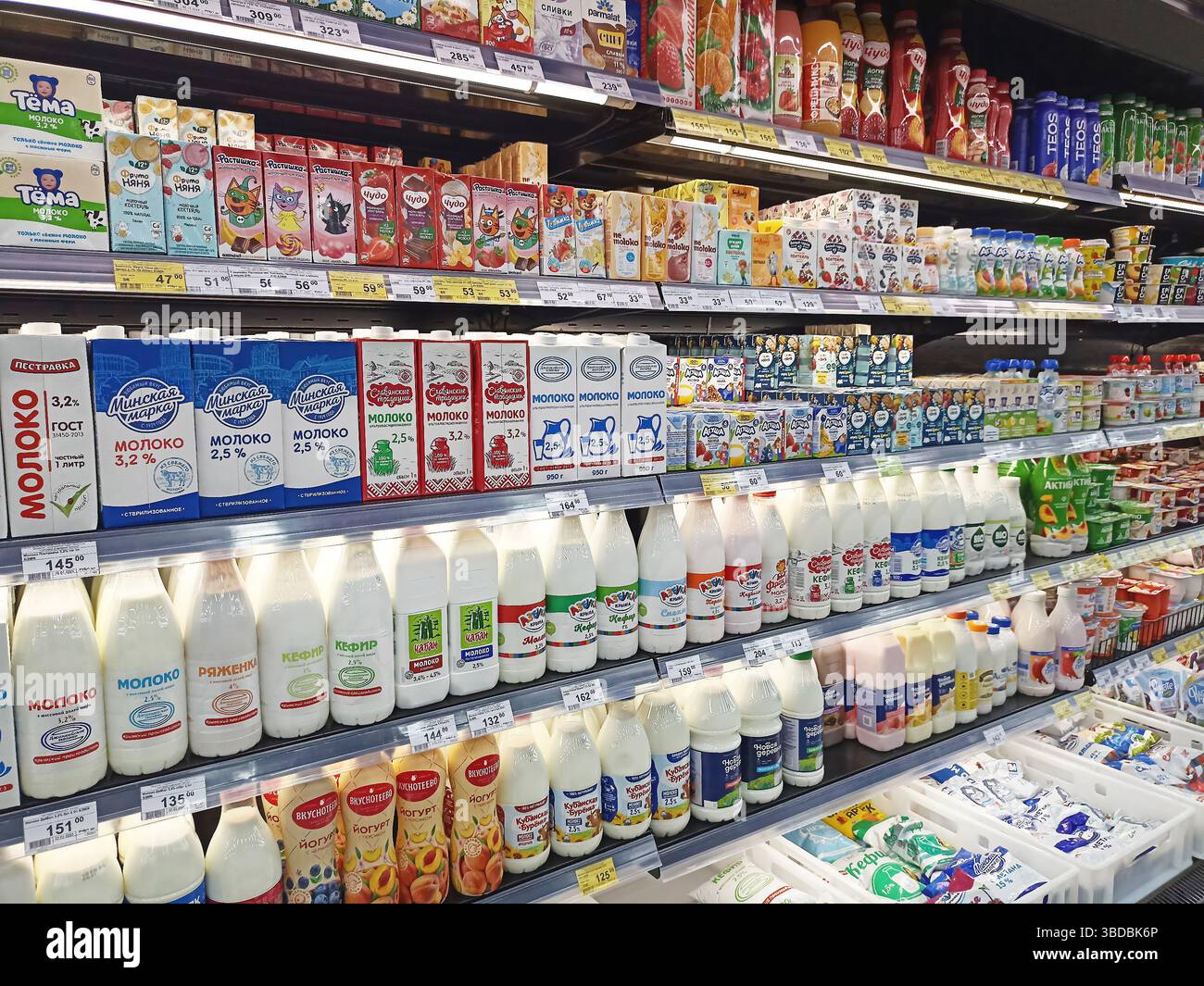 Variety of dairy and juice products in supermarket aisle Stock Photo ...