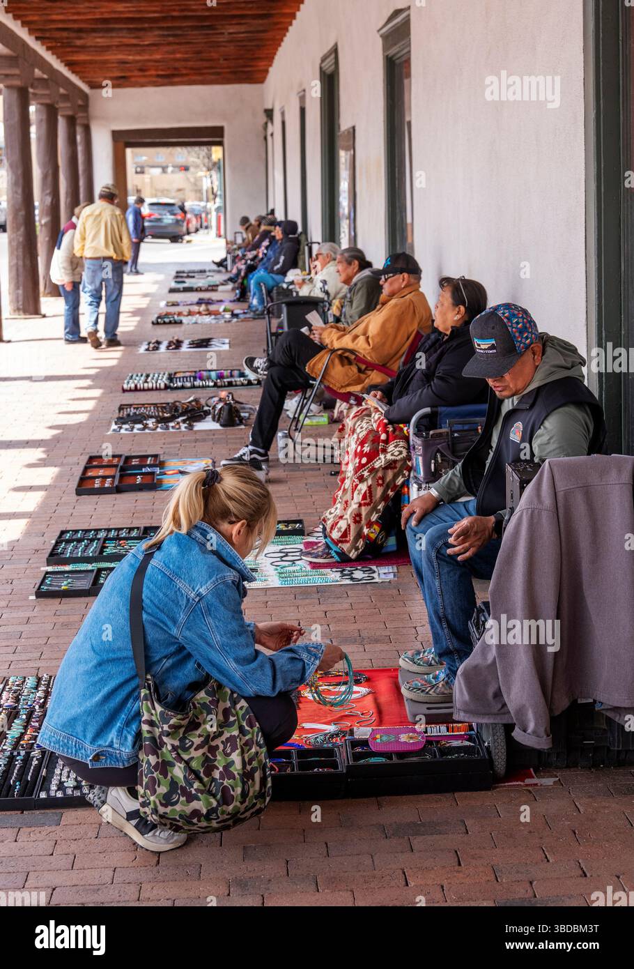 Tourists shop for native american jewelry and souvenirs; Santa Fe Plaza ...