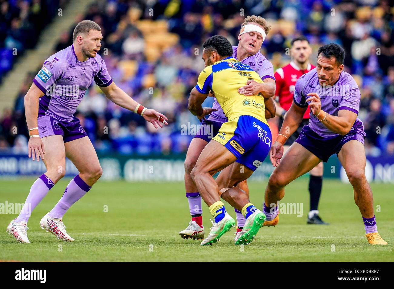 WARRINGTON, ENGLAND - MAY 23: Rodrick Tai is tackled by Jez Litten ...