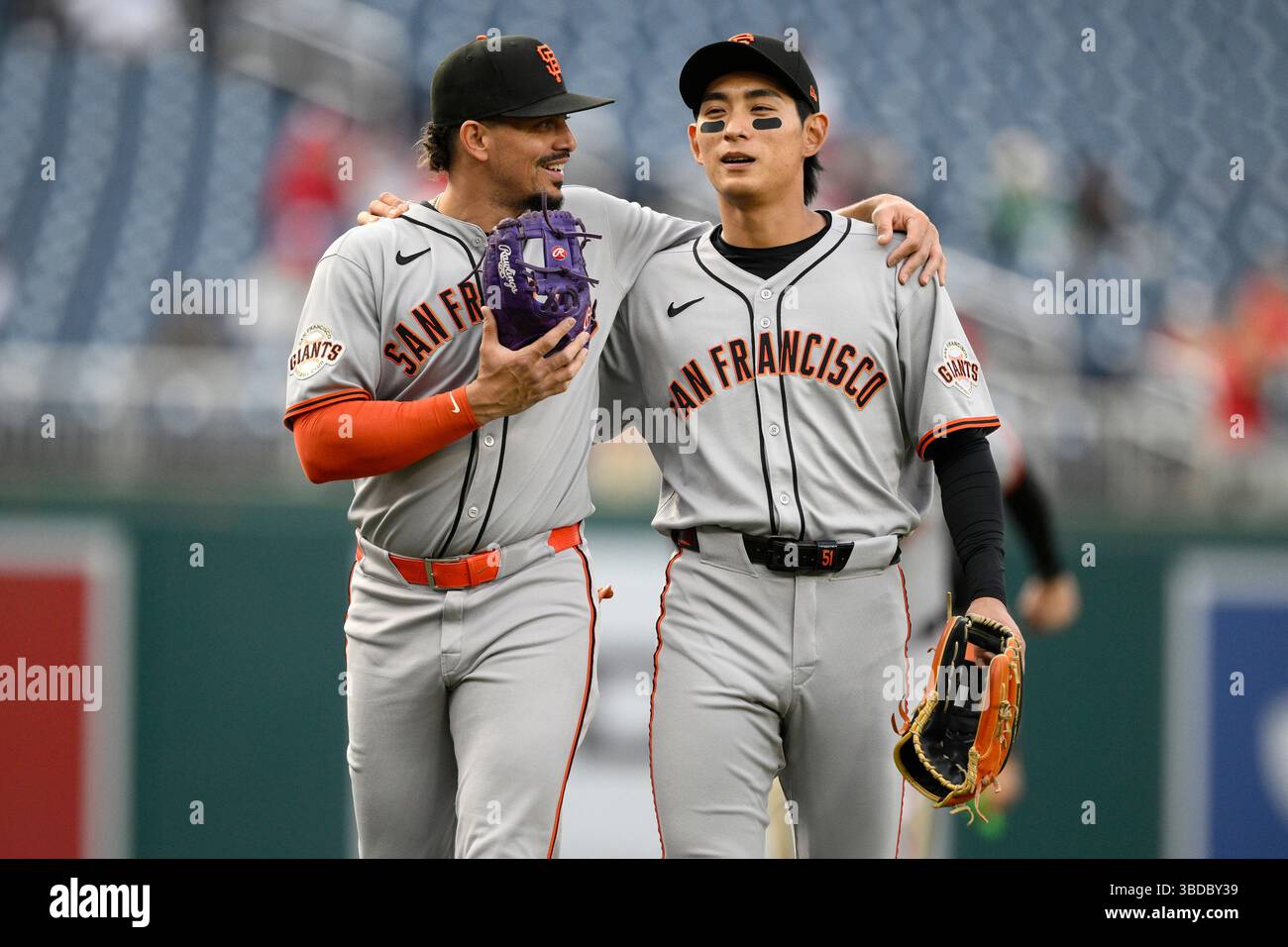 San Francisco Giants' Willy Adames, left, and Jung Hoo Lee, right, walk ...