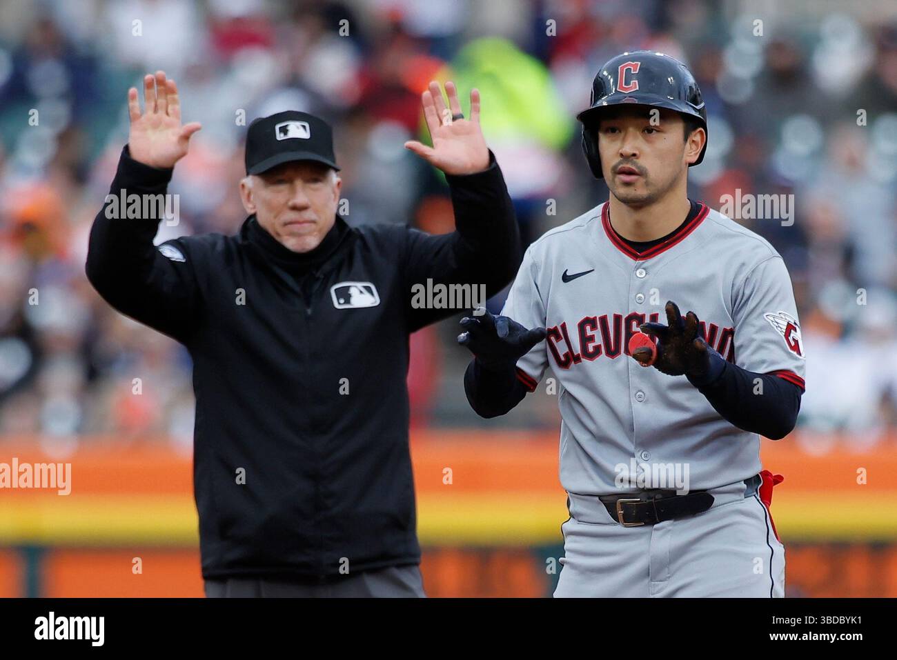 Cleveland Guardians' Steven Kwan, right, celebrates after his double ...