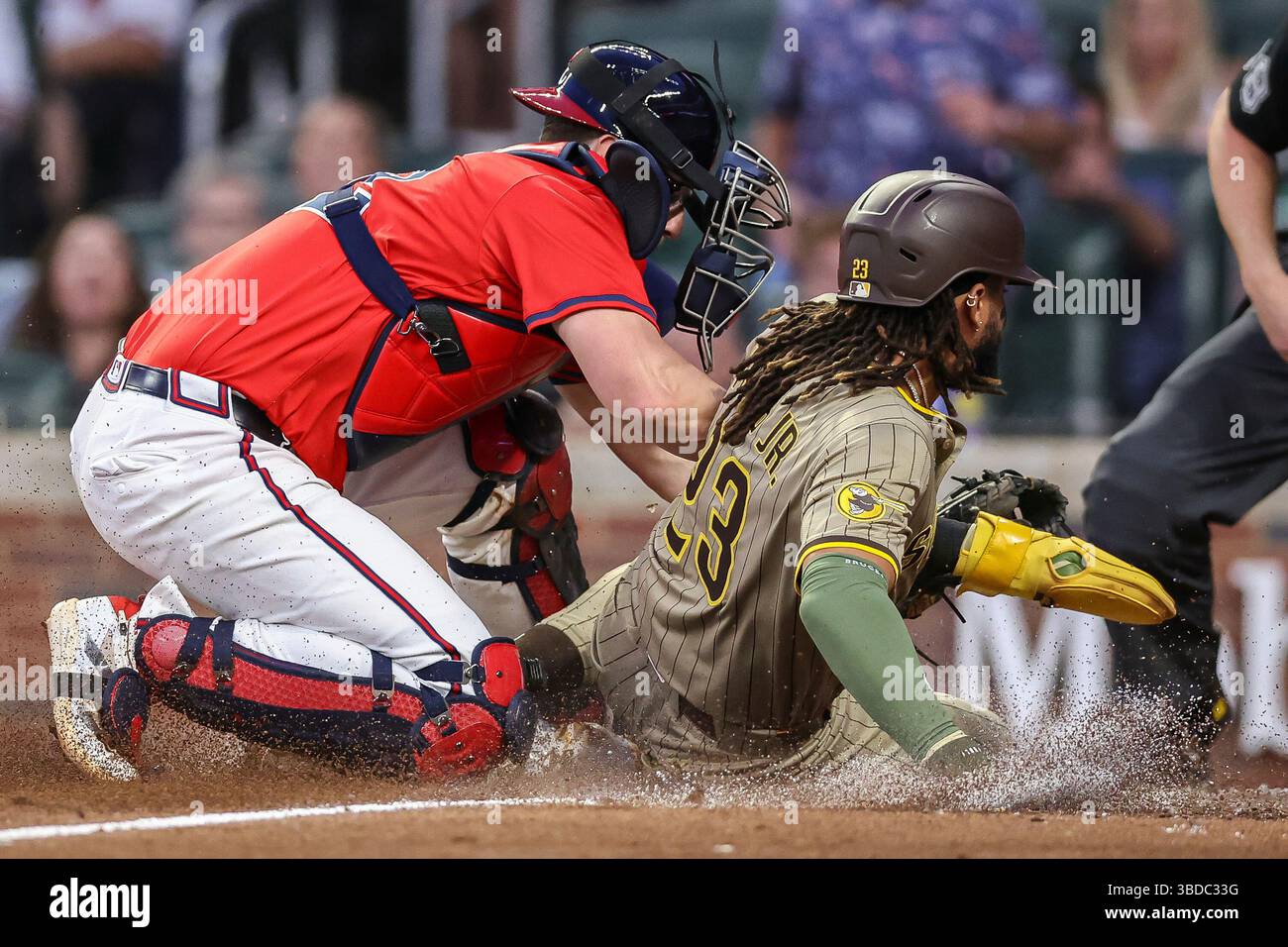 Atlanta Braves catcher Sean Murphy, left, tags out San Diego Padres' Fernando Tatis Jr., right ...