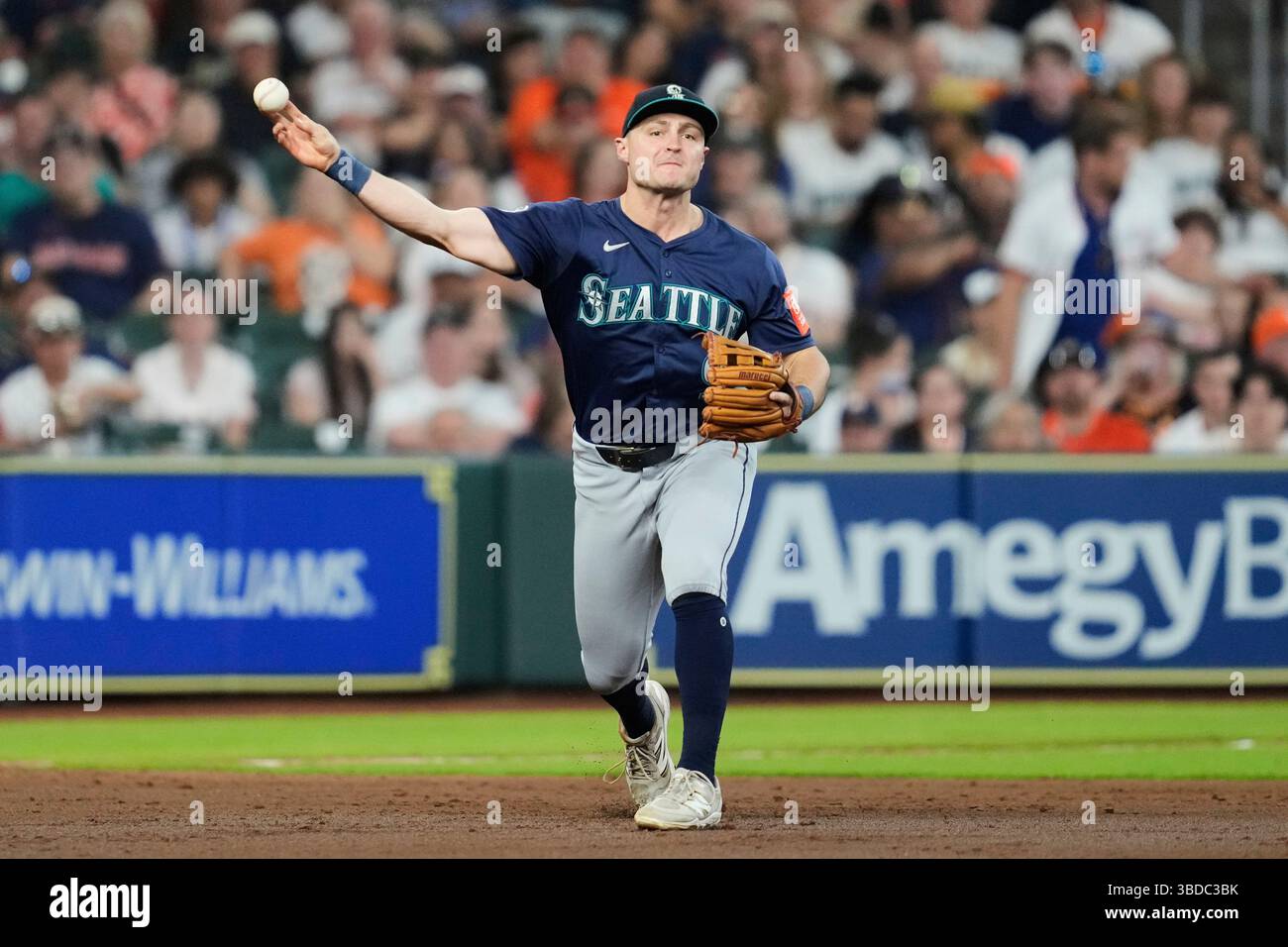 Seattle Mariners third baseman Ben Williamson throws to first to out ...
