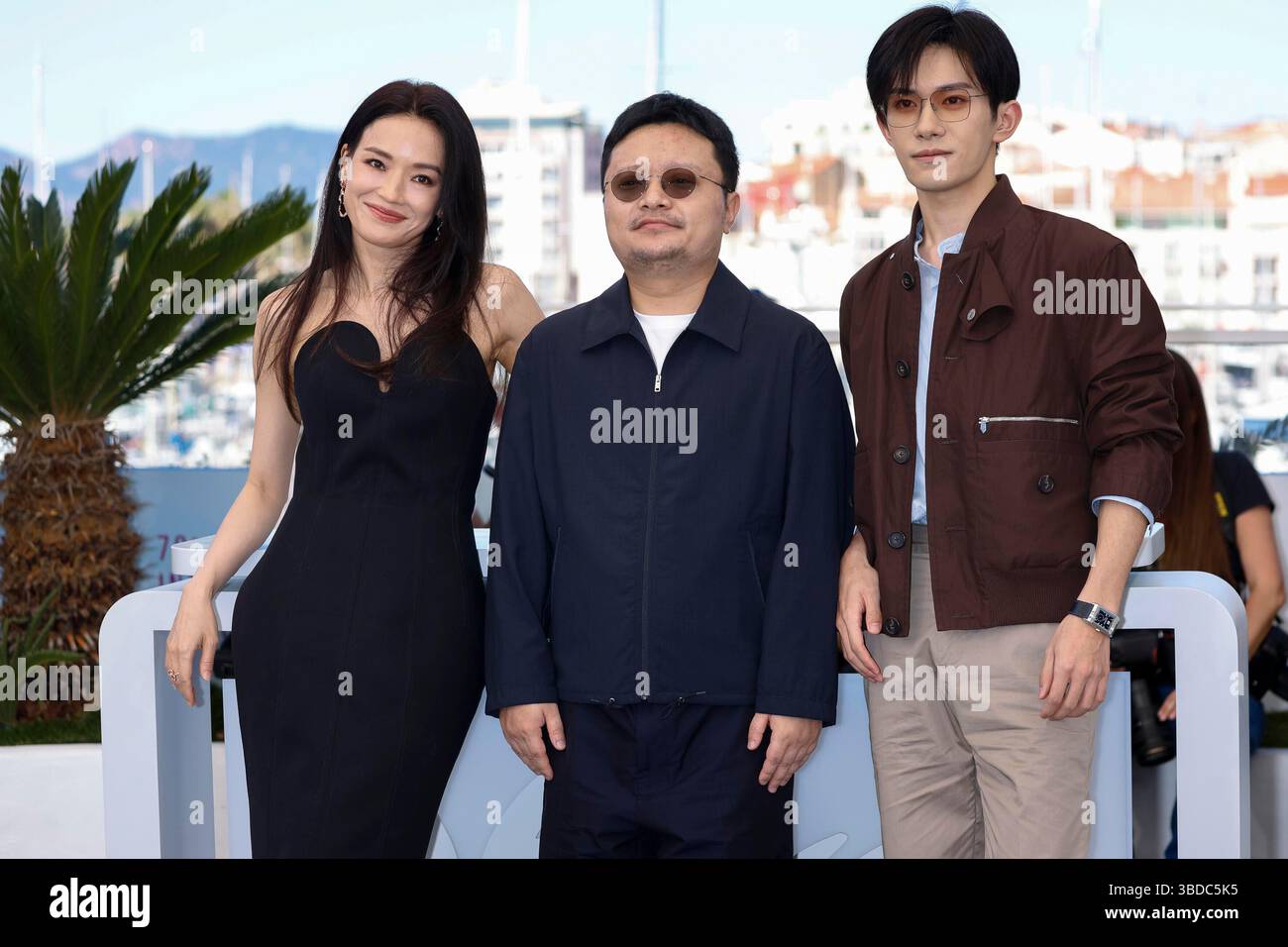 Shu Qi, Jackson Yee and Gengxi Li pose at the photocall of ...