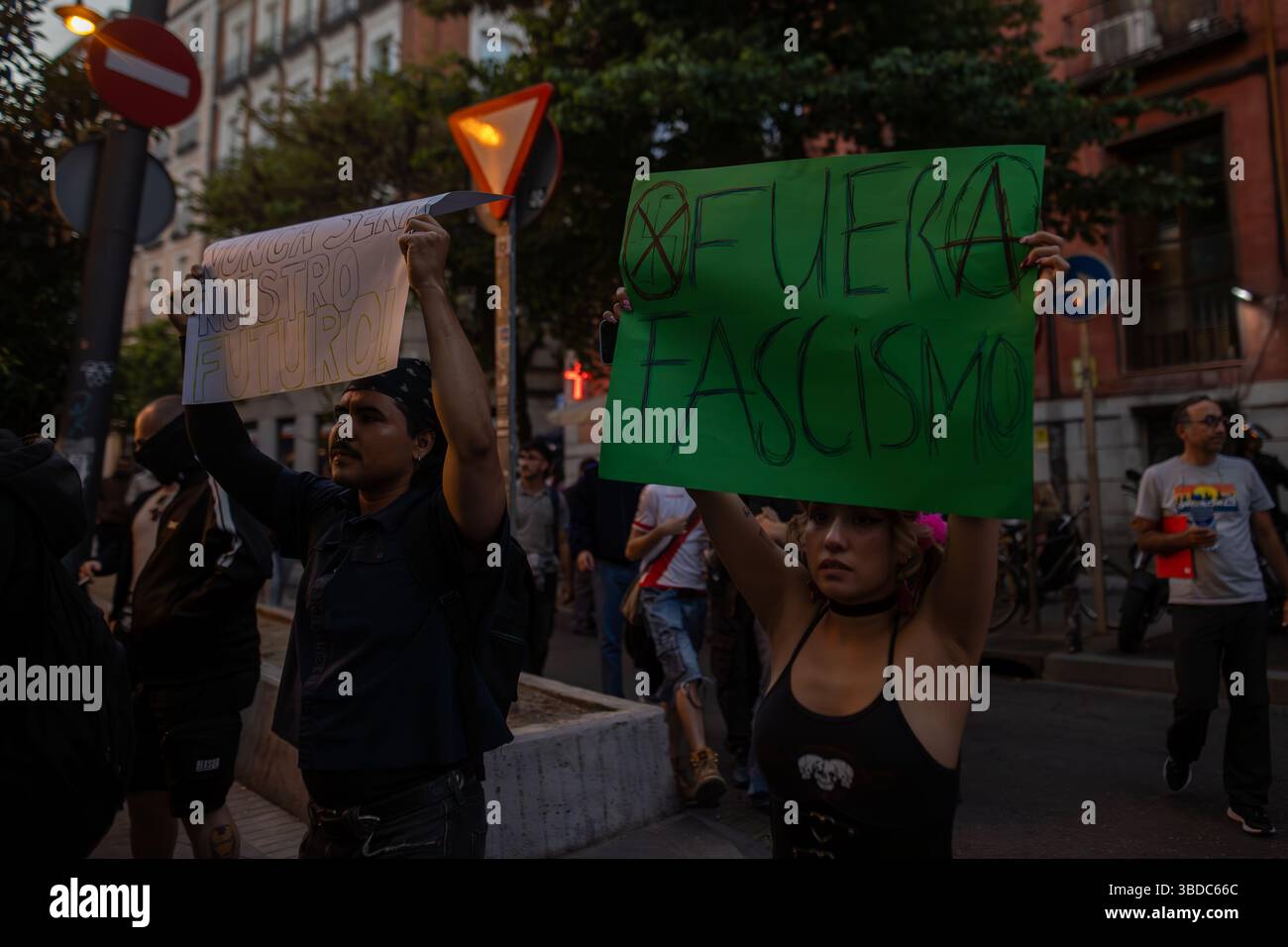 Protesters hold placards expressing their opinion during an anti ...